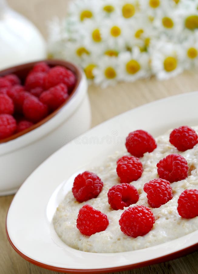 Porridge with raspberries stock photo. Image of bowls - 25843360