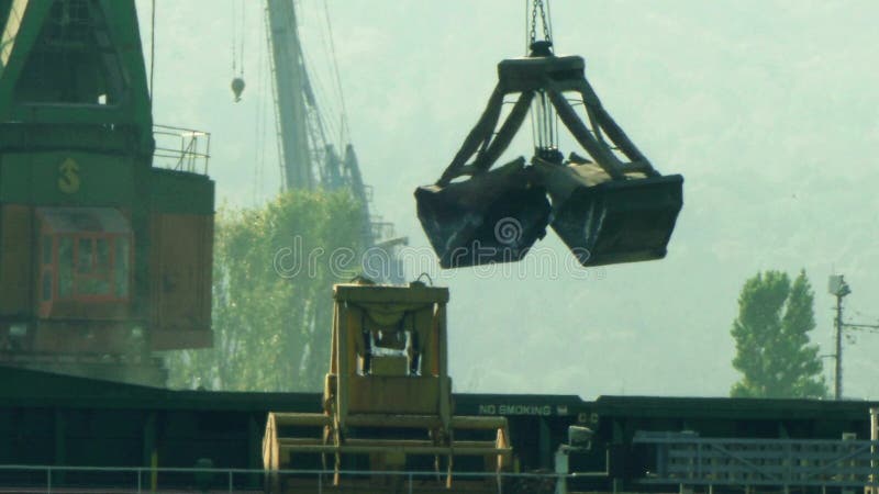 A Port Crane Unloads Crushed Stone and Other Bulk Materials from a Bulk ...