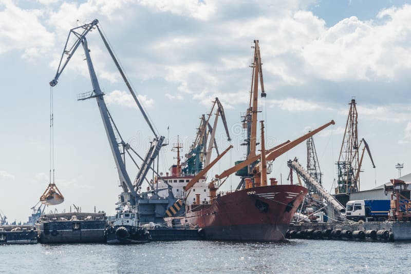 Port Cranes and Equipment for Loading and Unloading Cargo. the Concept ...