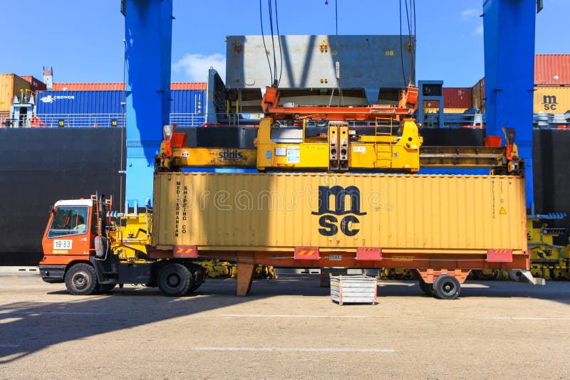 Port Dock with Container Ship and Various Brands and Colors of Shipping ...