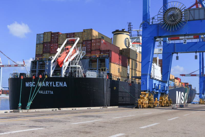 Port Dock with Container Ship and Various Brands and Colors of Shipping ...
