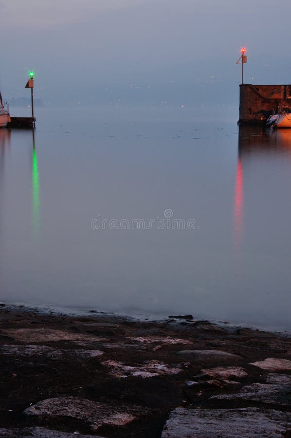 Port entrance at night stock photo. Image of sailing - 46778698