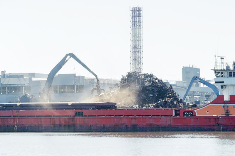 In Port Loading and Unloading Scrap Metal on a Barge Stock Image ...