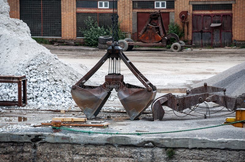 Port Work: Loading and Unloading Large Piles of Sand Stock Photo ...