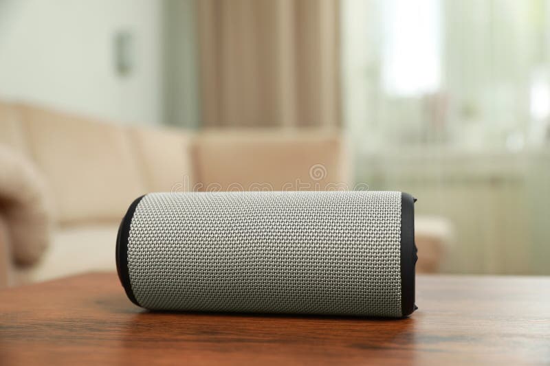 Portable Bluetooth Speaker on Wooden Table Indoors. Audio Equipment ...