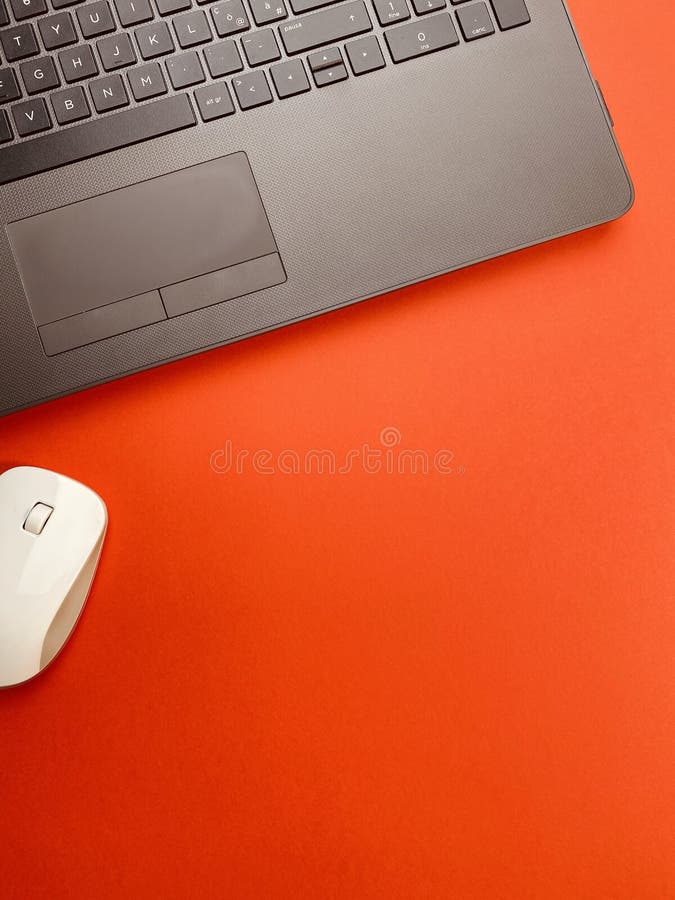 Laptop Computer Detail and Mouse on a Red Tabletop Directly Above View ...