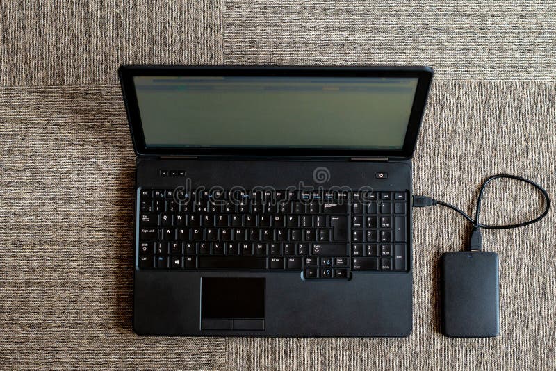 Portable Computer and USB Drive on a Light Textured Background ...