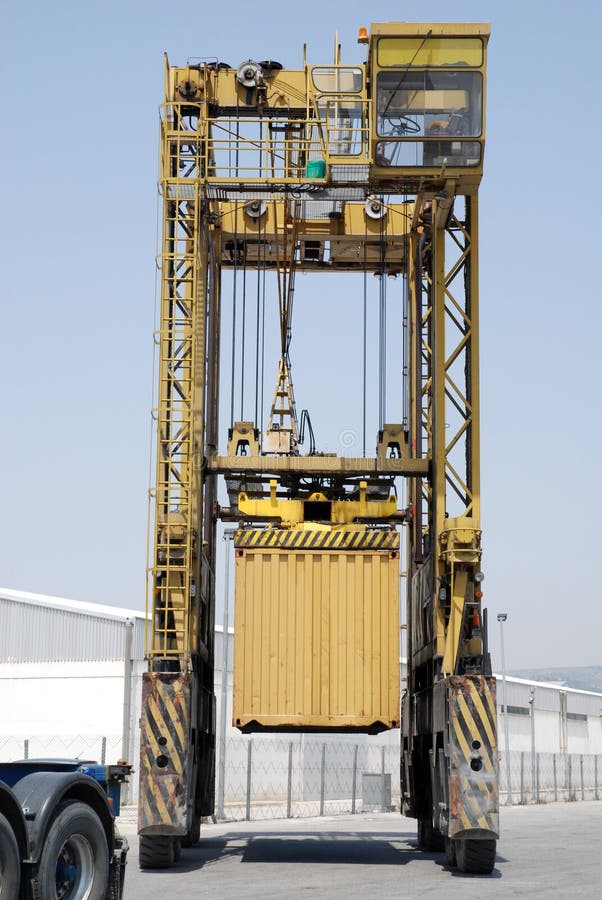 Port-crane Lowering Container To Awaiting Truck Stock Photo - Image of ...