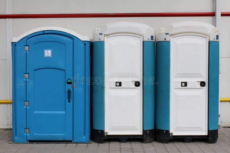 Portable Blue and White Ecological Toilet Behind Tall Trees Stock Photo ...