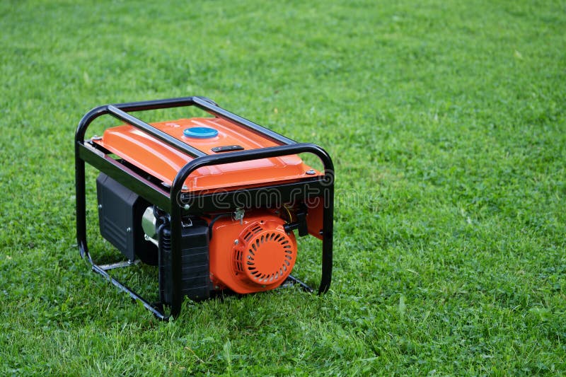 Portable Electric Generator on the Green Grass Outdoors Stock Photo ...
