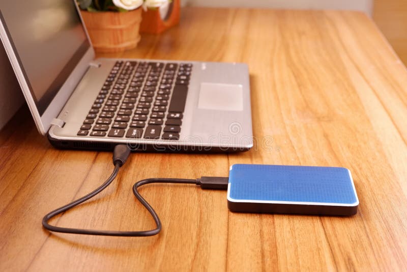 Portable External Hard Drive USB3.0 Connect To Laptop Computer on Desk ...