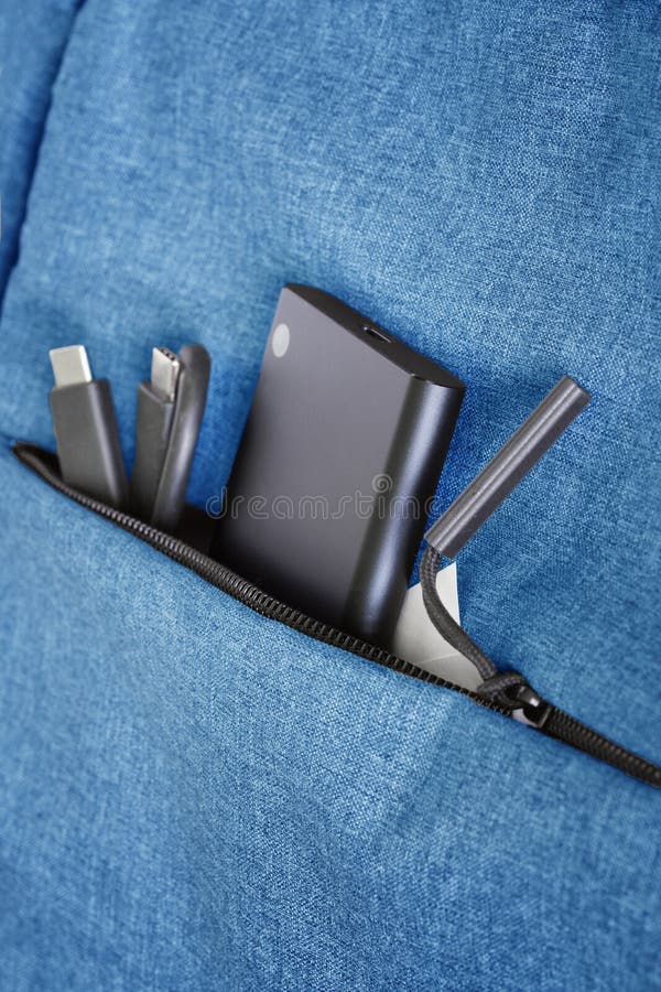Portable External Ssd and Usb Cable in the Pocket of a Denim Jacket or ...