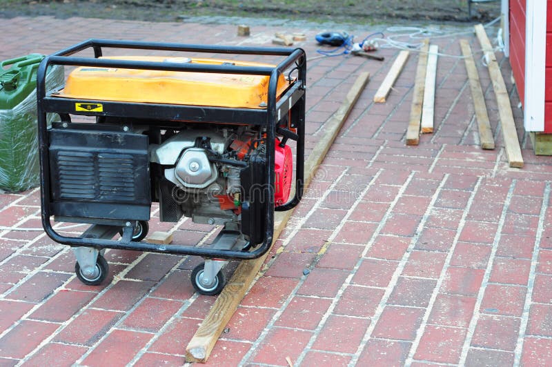 Portable Generator with Wheels on the House Construction Site. Close Up ...