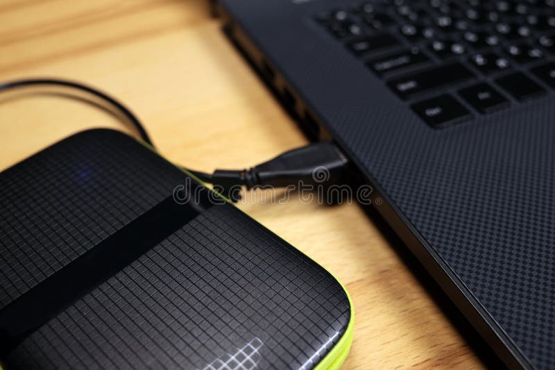 Portable Hdd Connected To a Laptop, Data Sharing Concept Stock Photo ...