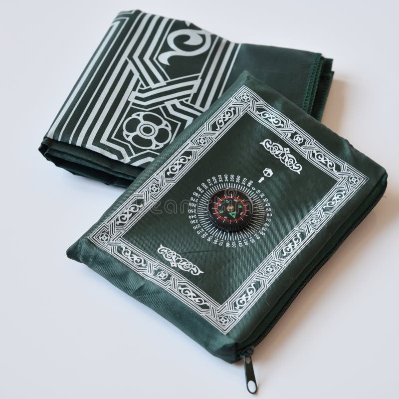Portable Islamic Prayer Mat with Compass To Point To Mecca Stock Image ...