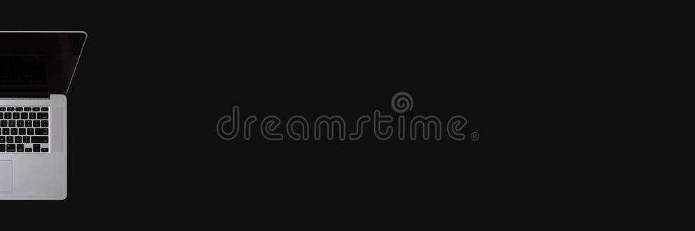 Portable Modern Silver Computer on a Black Background. Half the ...