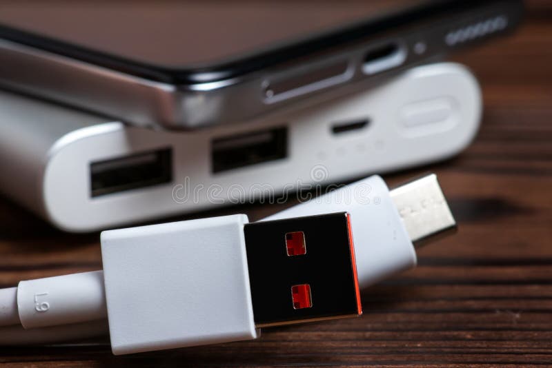 Portable Power Bank with USB Cable and Smartphone for Charging Mobile ...