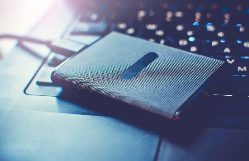 Portable SSD State Solid Drives Disk on a Laptop Keypad, Close Up Stock ...