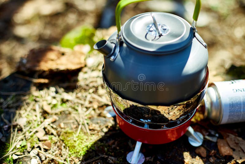 Outdoor Kettle Boiling Water on Portable Stove in a Serene Forest ...