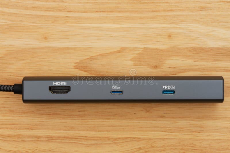 Portable USB-C Hub for Connecting USB Devices on Wood Desk Stock Image ...