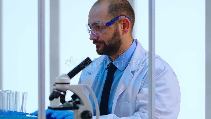 Portait of Chemist Typing on Computer Checking Virus Development Stock ...