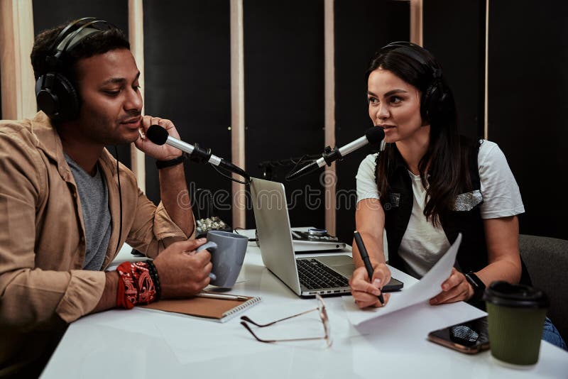Portait of Two Radio Hosts, Young Man and Woman Editing, Discussing ...