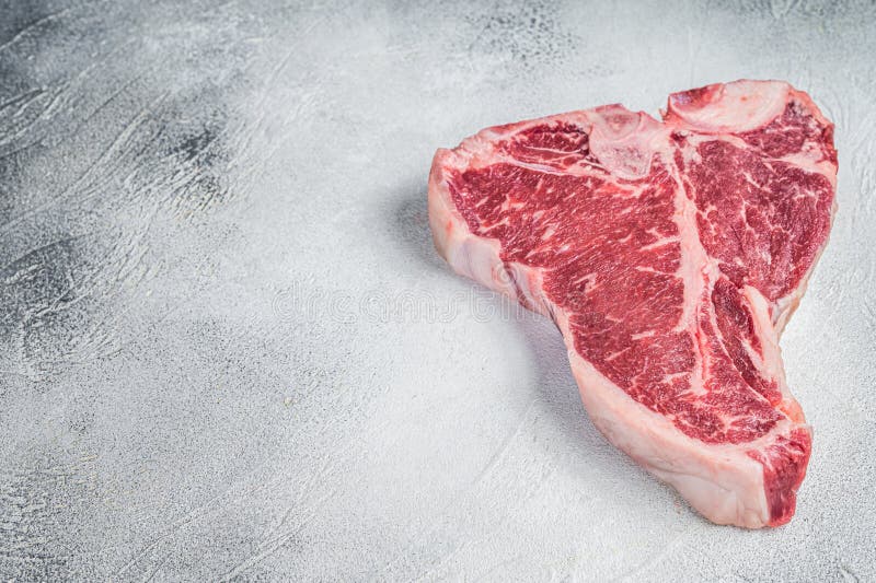 Porterhouse T-bone Raw Beef Meat Steak. White Background. Top View ...