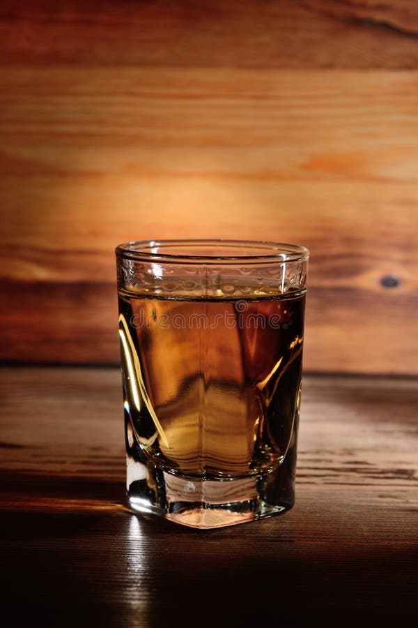 A Portion of Aged Alcohol in a Glass, Close-up Against the Background ...