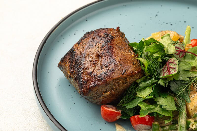 Portion of Beef Mignon Steak with Vegetables Stock Photo - Image of ...