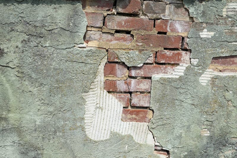 A Portion of a Broken Plaster Wall with with Underlying Exposed Red ...