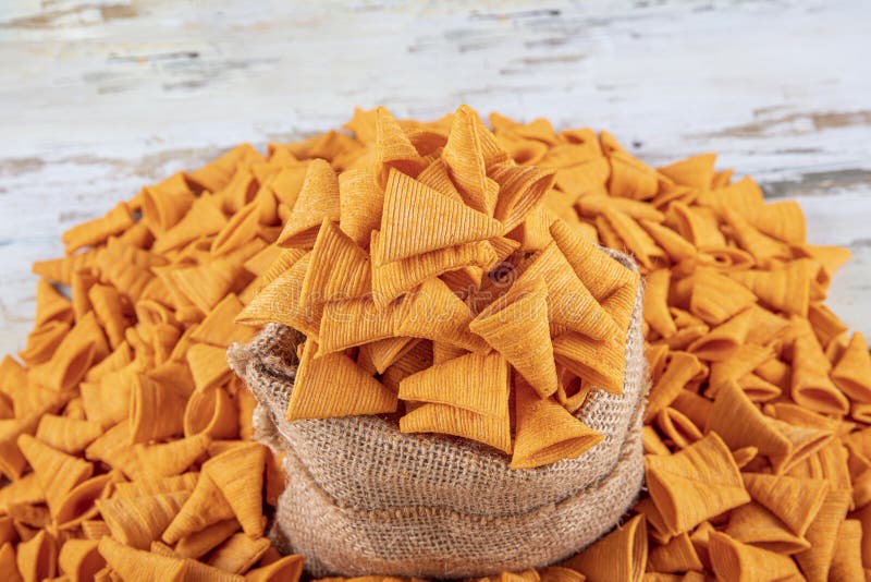 Portion of Cone Shaped Snack Tornado Shaped Crackers. Yellow Spicy ...