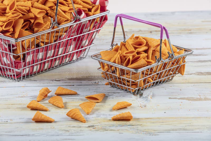 Portion of Cone Shaped Snack Tornado Shaped Crackers. Yellow Spicy ...