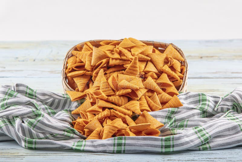 Portion of Cone Shaped Snack Tornado Shaped Crackers. Yellow Spicy ...