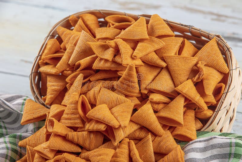Portion of Cone Shaped Snack Tornado Shaped Crackers. Yellow Spicy ...