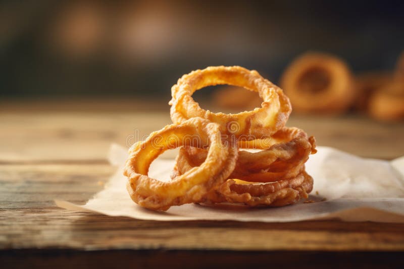 Portion of Crispy Fried Onion Rings on Rustic Wooden Table. AI ...