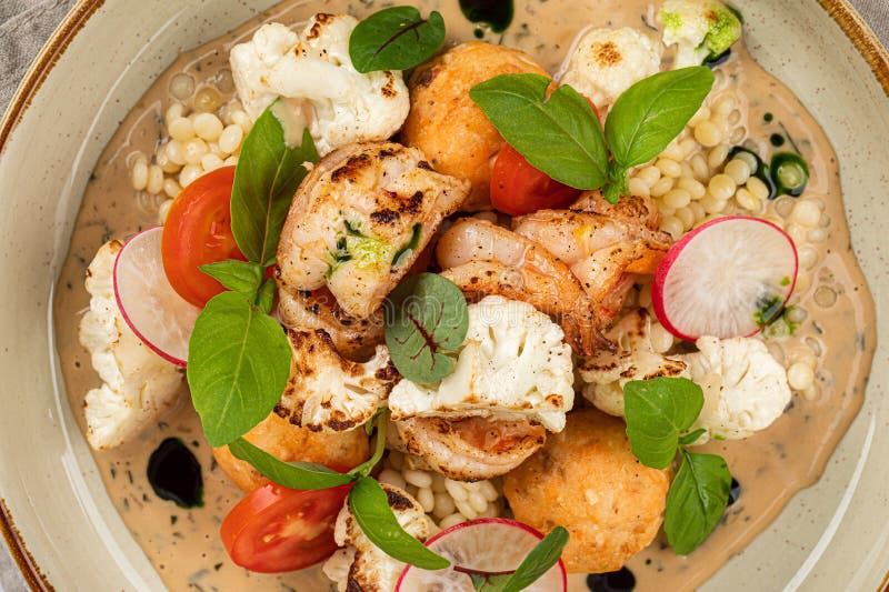 Portion of Dish with Ptitim and Seafood Stock Image - Image of herbs ...