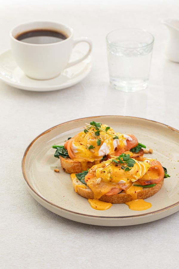 Portion of Eggs Benedict Toast with Salmon Stock Photo - Image of ...