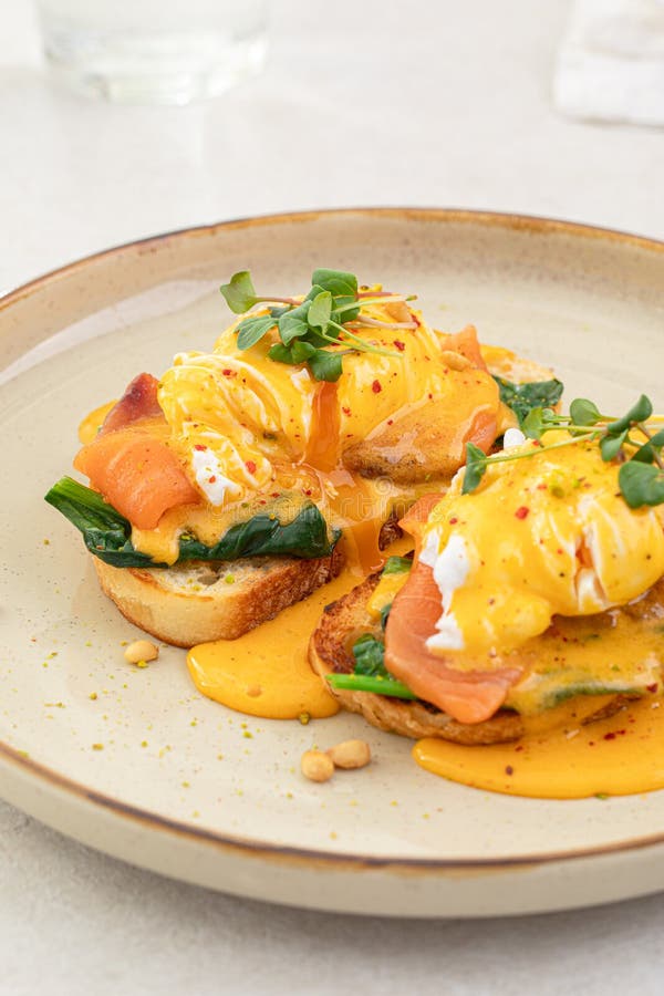 Portion of Eggs Benedict Toast with Salmon Stock Photo - Image of ...