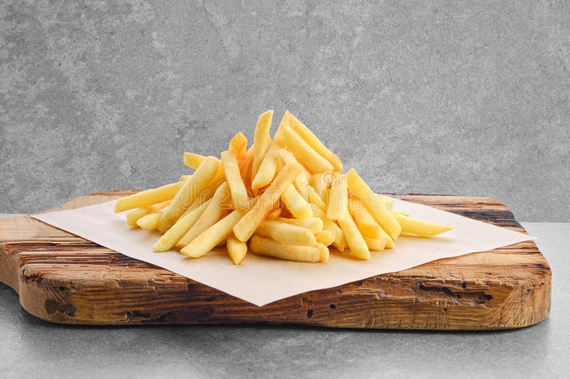 Portion of French Fries on Paper Stock Photo - Image of paper, fried ...