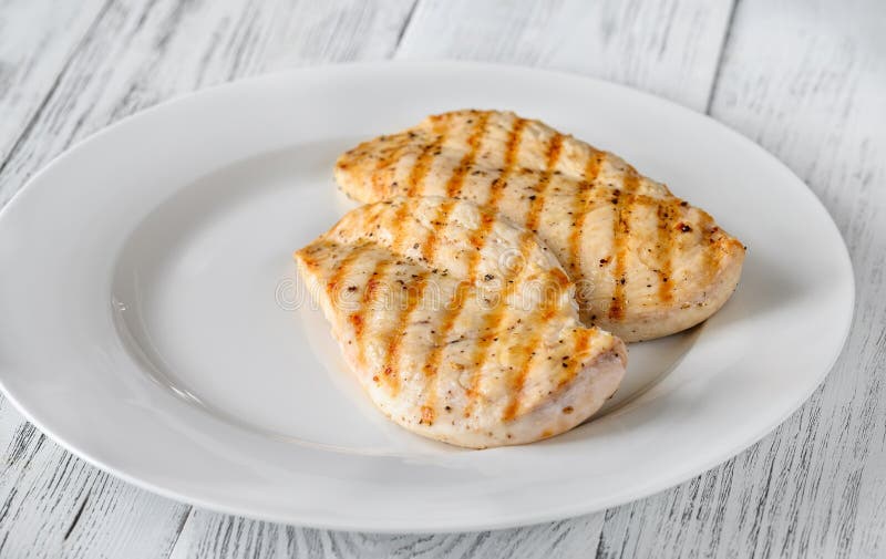 Portion of grilled chicken stock image. Image of portion - 174419129
