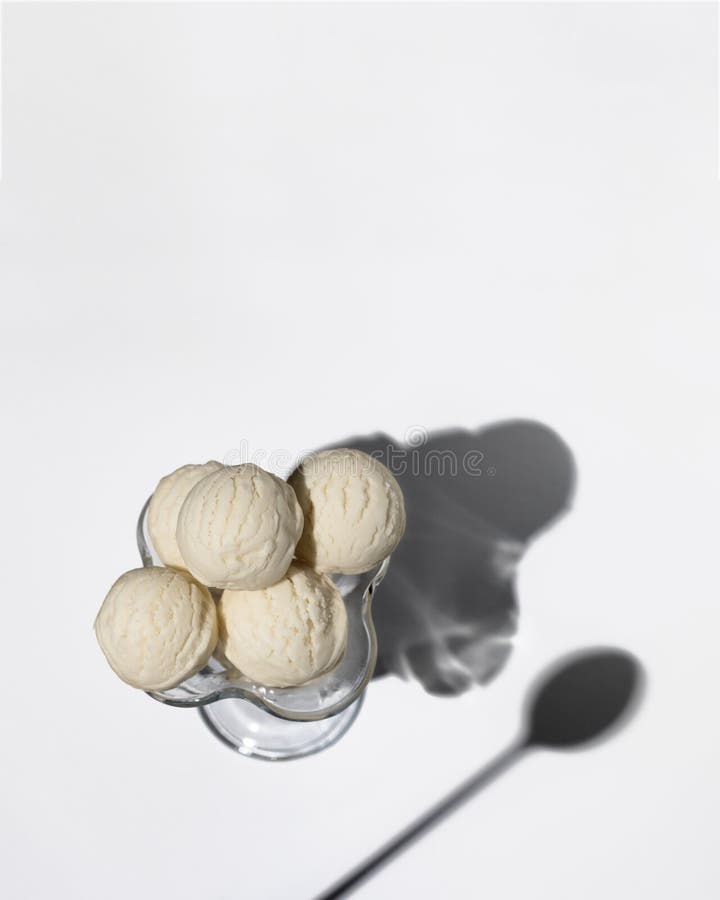 Portion of Ice Cream in the Glass Bowl and the Shadow of Spoon Stock ...