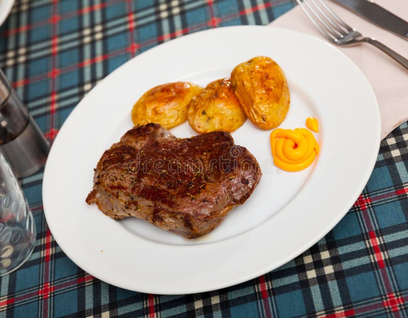 Portion of Just Cooked Beef Steak with Potatoes Stock Photo - Image of ...