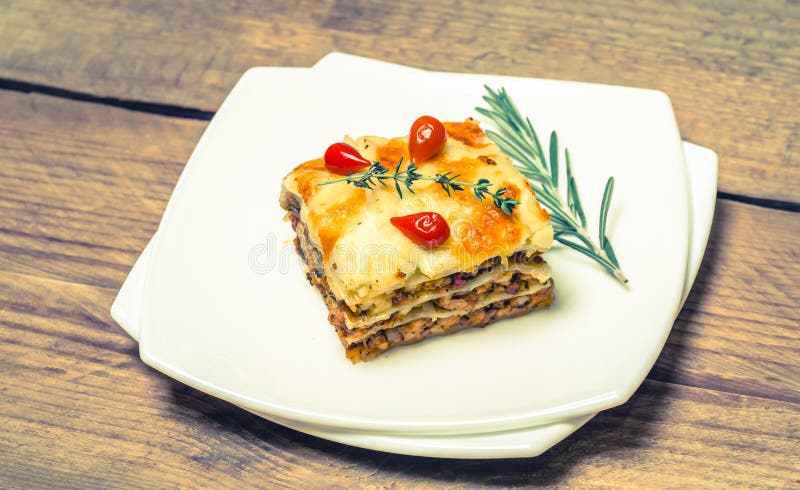Portion of Lasagna on the Wooden Table Stock Photo - Image of melted ...