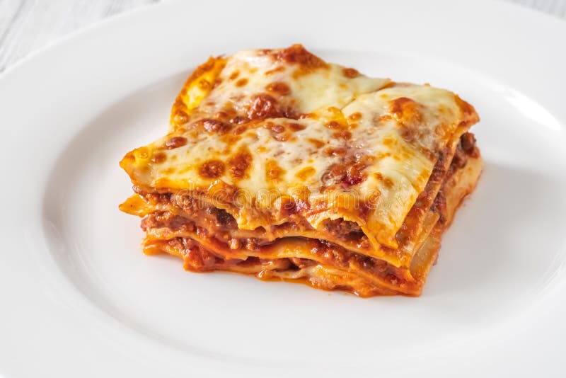 Portion of Lasagne on White Plate Stock Photo - Image of close, crust ...