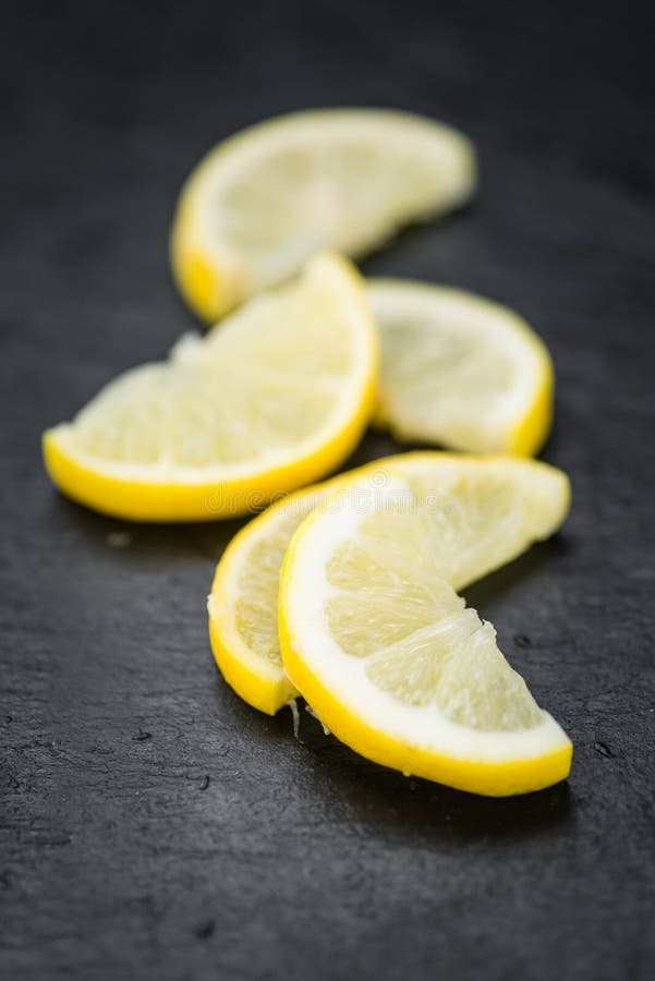 Portion of Lemon Sliced on a Slate Slab Stock Photo - Image of close ...