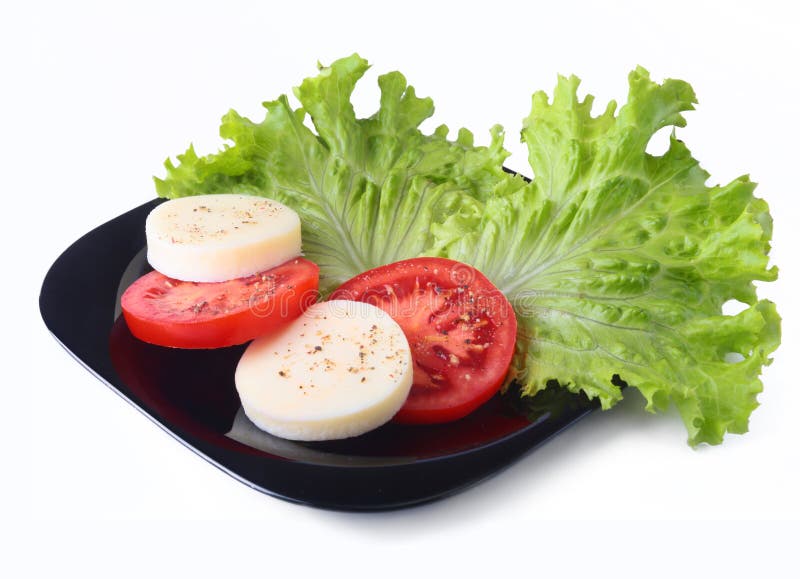 Portion of Mozzarella with Tomatoes, Lettuce Leaf and Balsamic Dressing ...