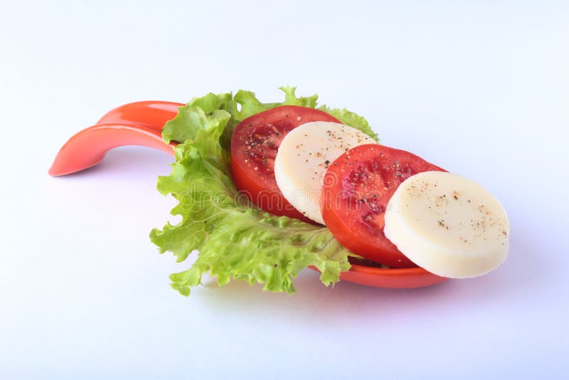 Portion of Mozzarella with Tomatoes, Lettuce Leaf and Balsamic Dressing ...