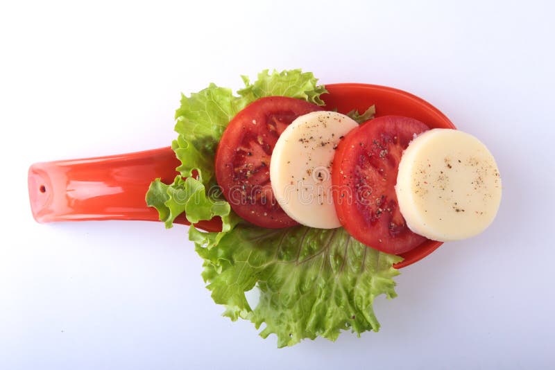 Portion of Mozzarella with Tomatoes, Lettuce Leaf and Balsamic Dressing ...