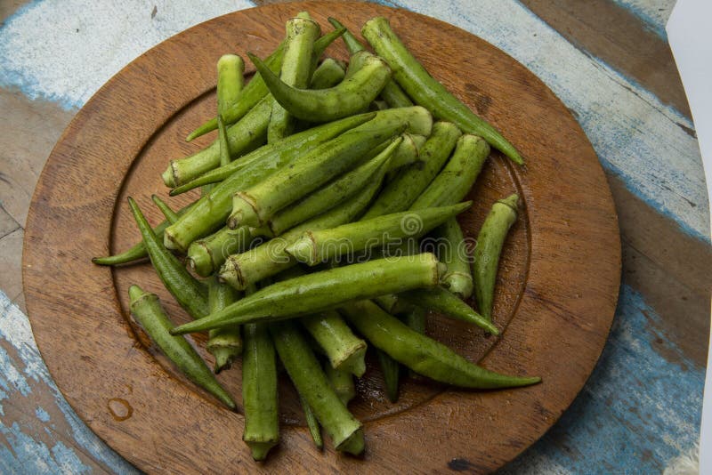 Portion of Okra on Wooden Plate Stock Photo - Image of bamia, cookery ...