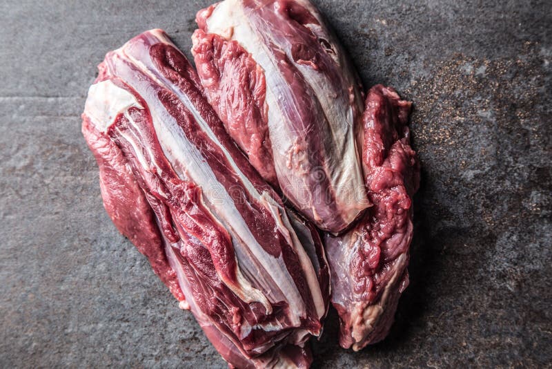 Portion of Raw Beef Shank on Dark Butcher Board Stock Photo - Image of ...